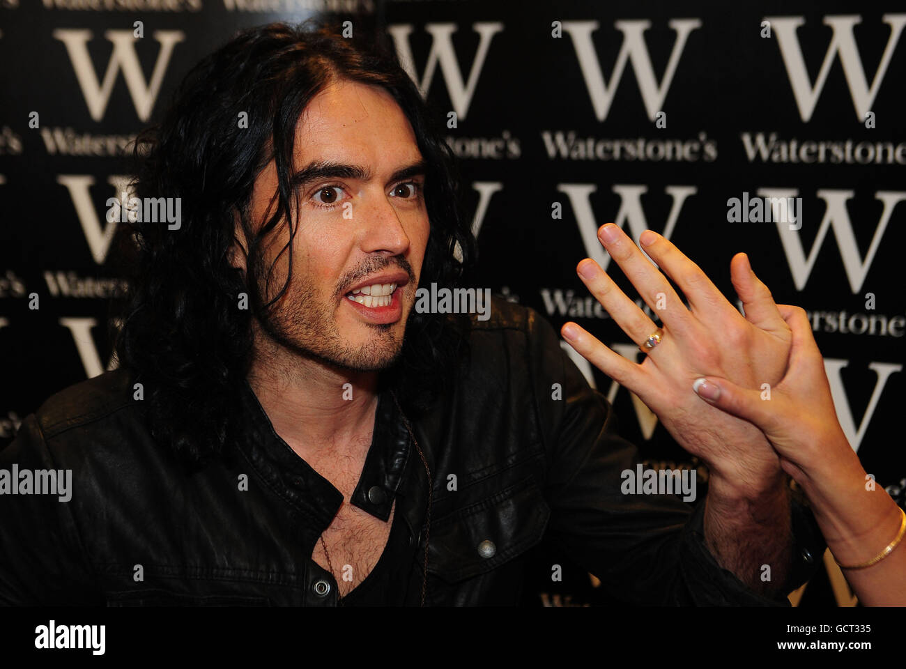 Russell Brand shows off his engagement ring at Waterstones in ...