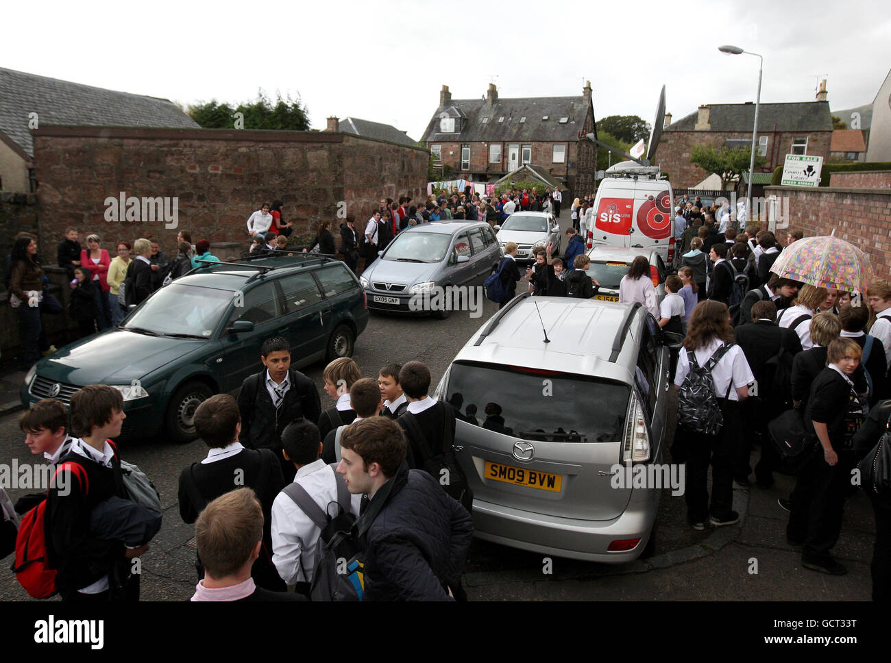 Locals gather to show their support outside a block of flats in ...