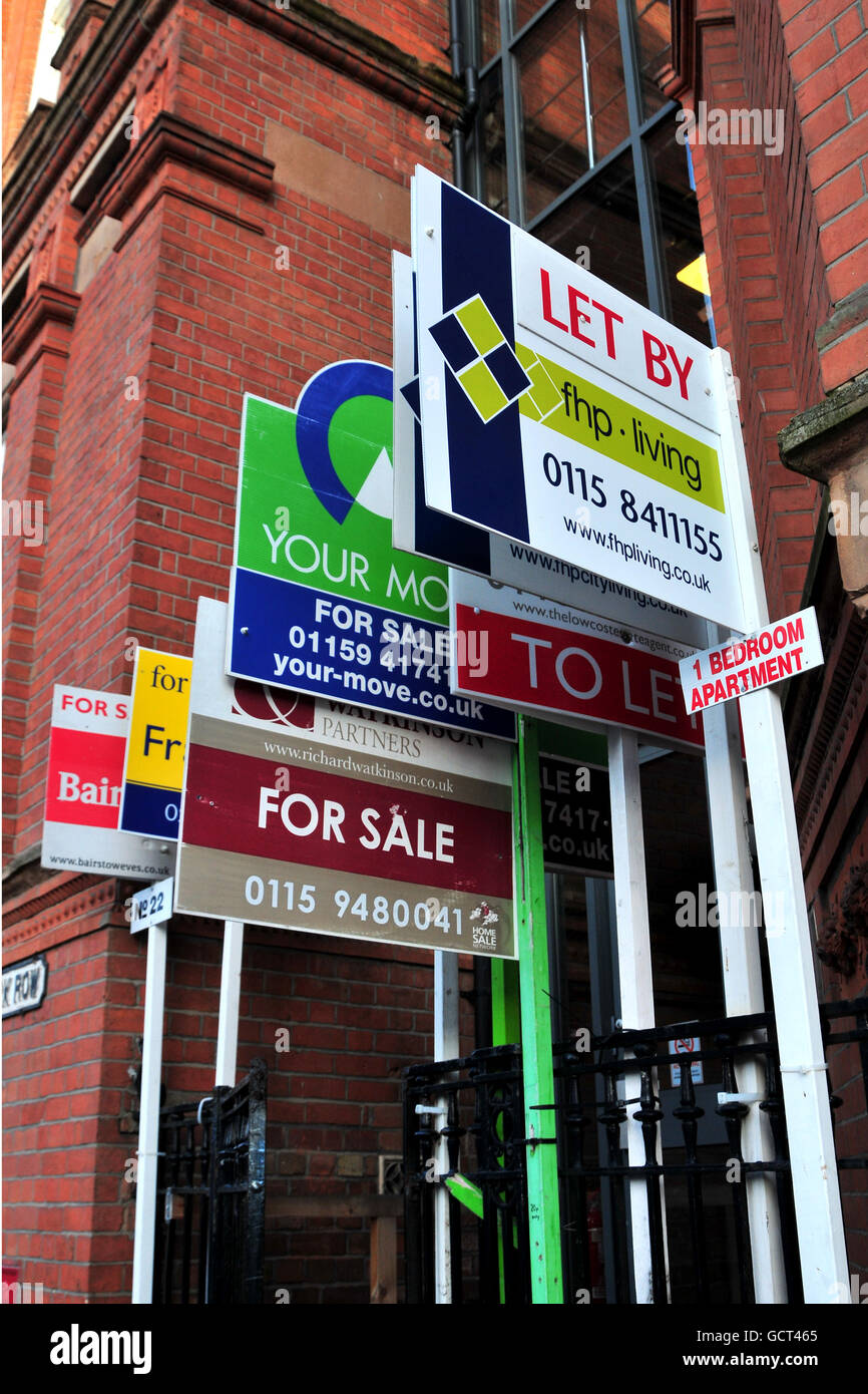 General view of for sale signs outside a block of flats Stock Photo - Alamy