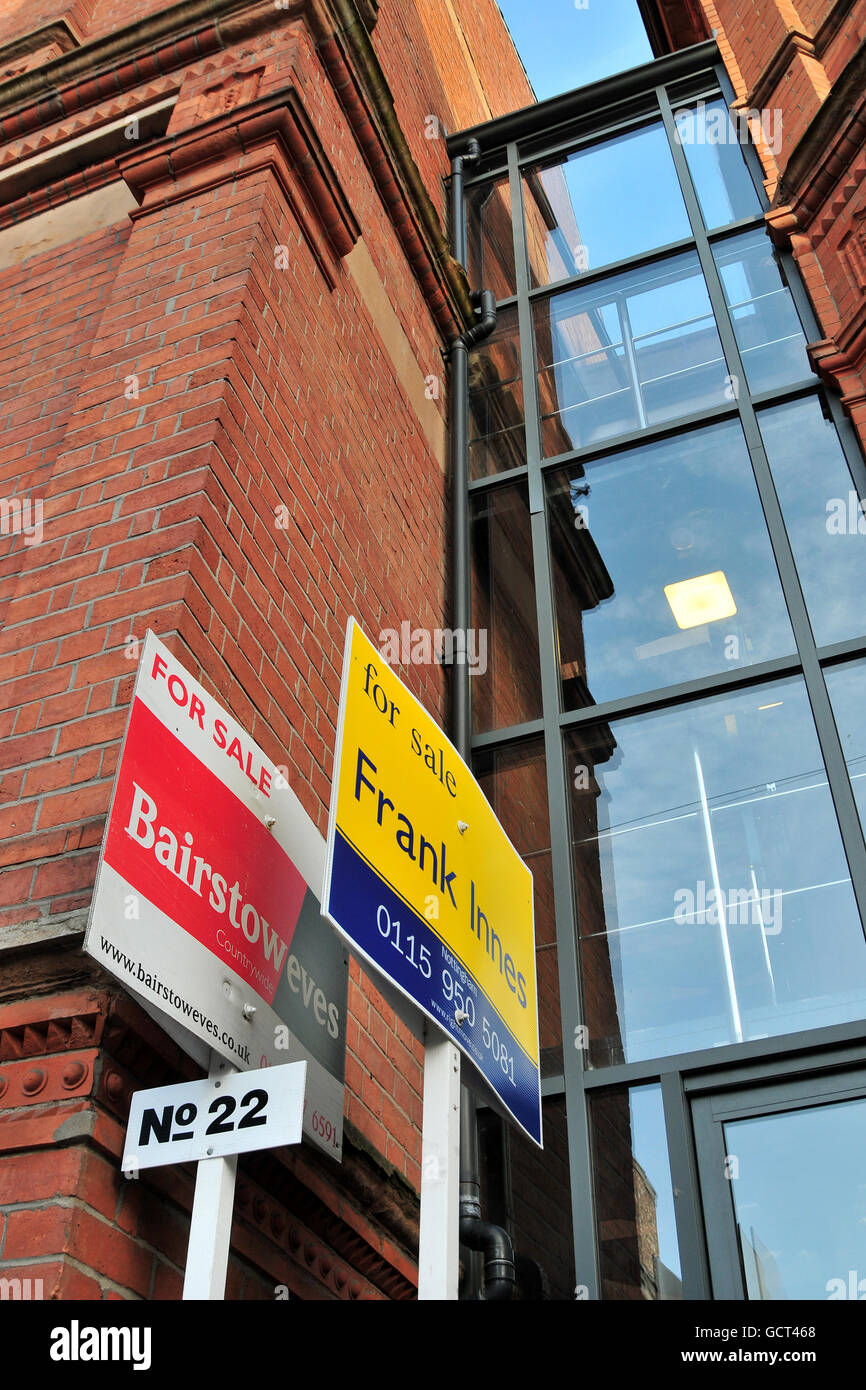 General view of for sale signs outside a block of flats Stock Photo - Alamy