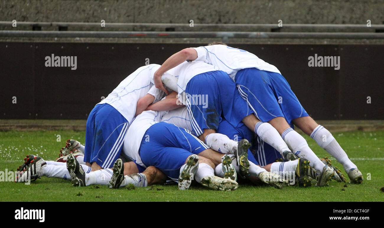 Faroe Islands' Christian Holst (obscured) is mobbed by teammates as he ...