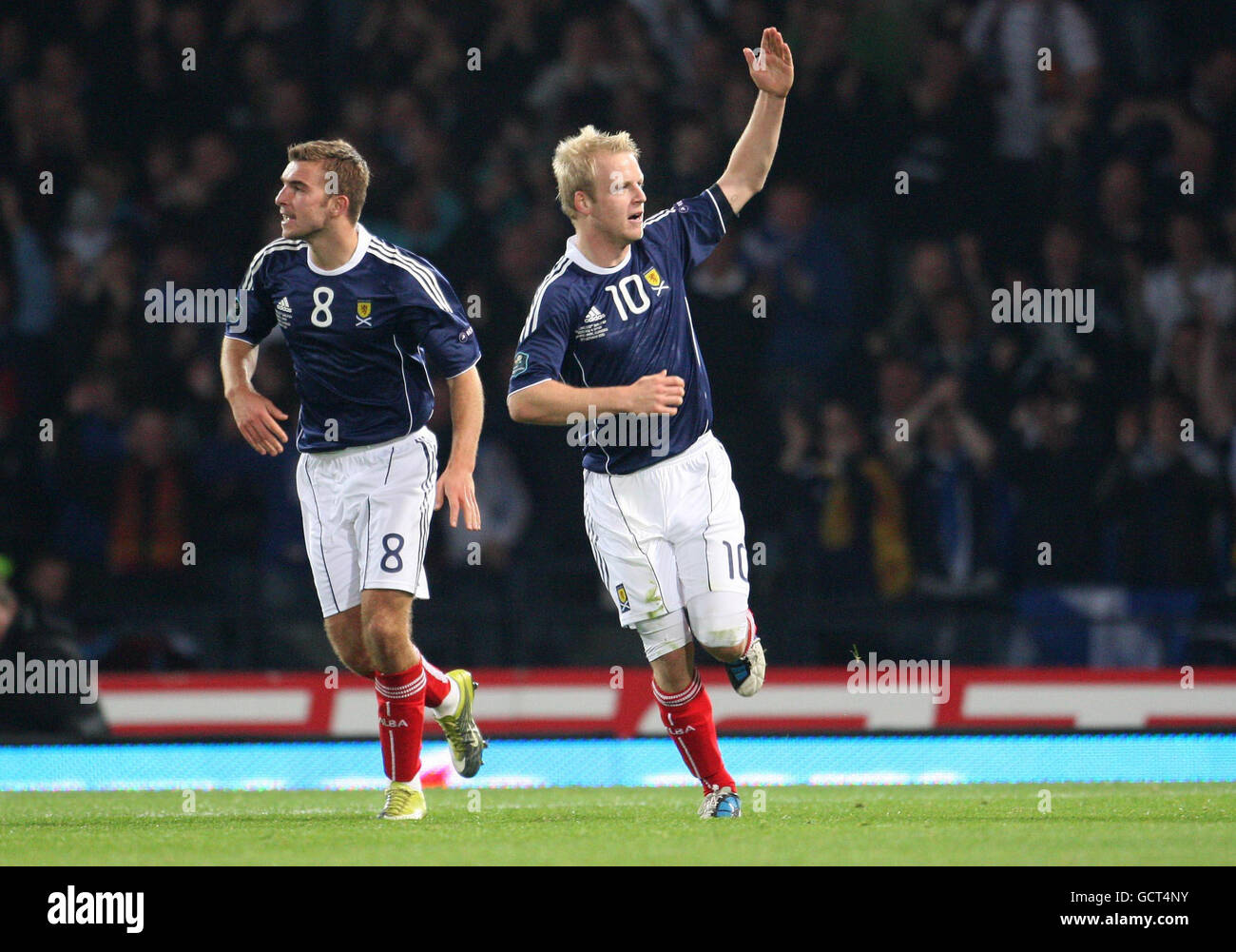 Scotland's Steven Naismith (right) celebrates scoring their first goal ...
