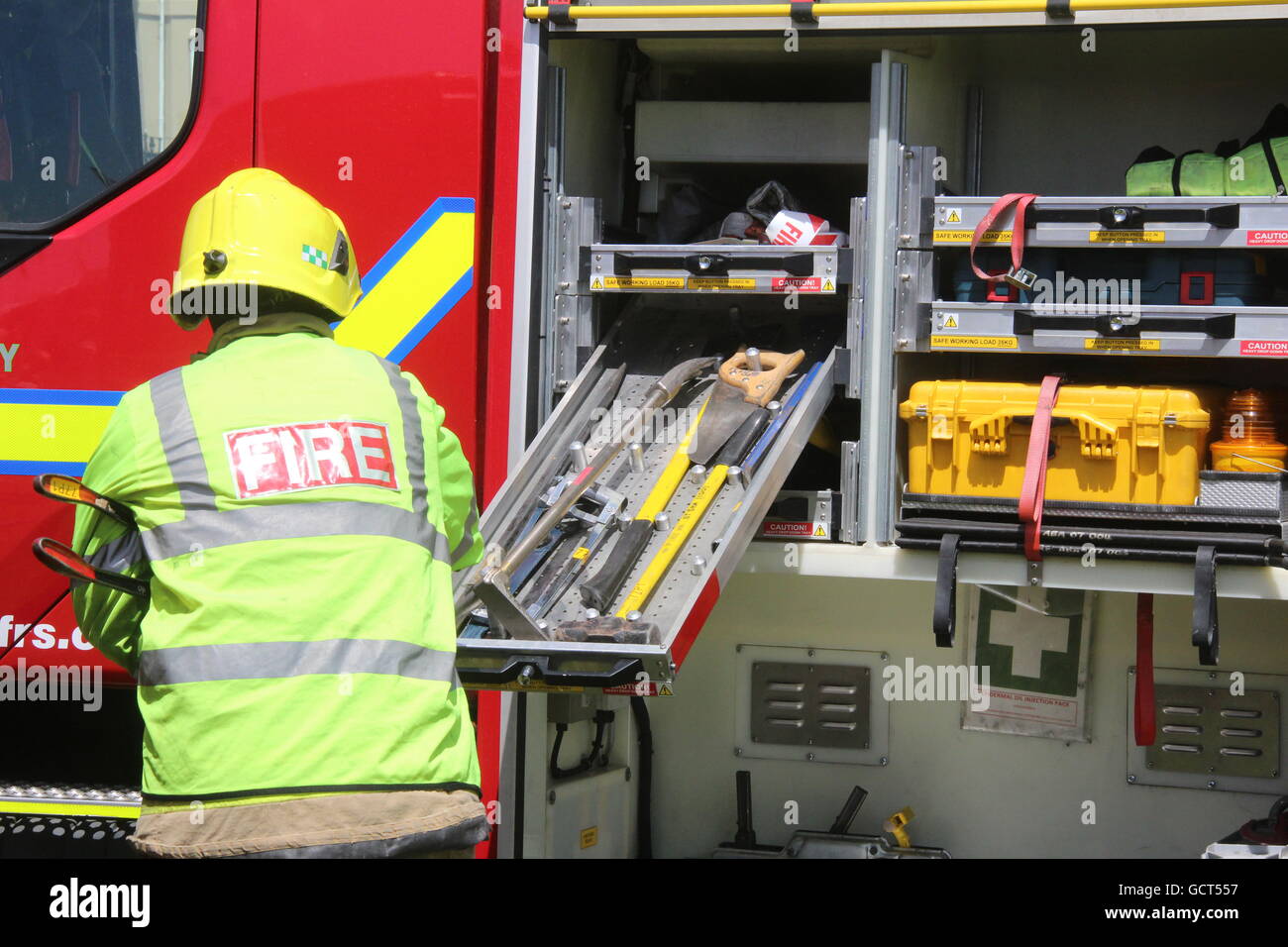 CLOSE-UP VIEW OF EAST SUSSEX FIRE & RESCUE SERVICE FIREFIGHTER LOADING ...