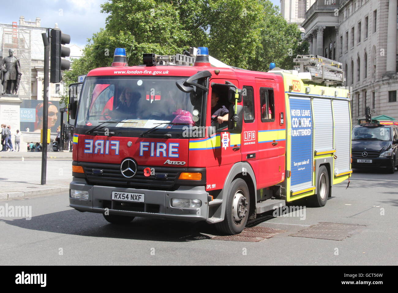 A SUNNY NEARSIDE LANDSCAPE VIEW OF A LONDON FIRE BRIGADE MERCEDES FIRE ...
