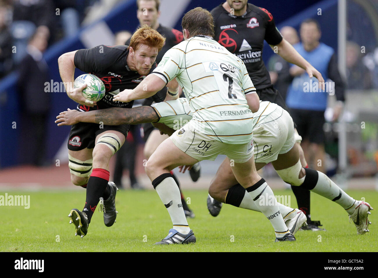 Edinburgh's Roddy Grant (left) tackled by Northampton Saints' Courtney ...
