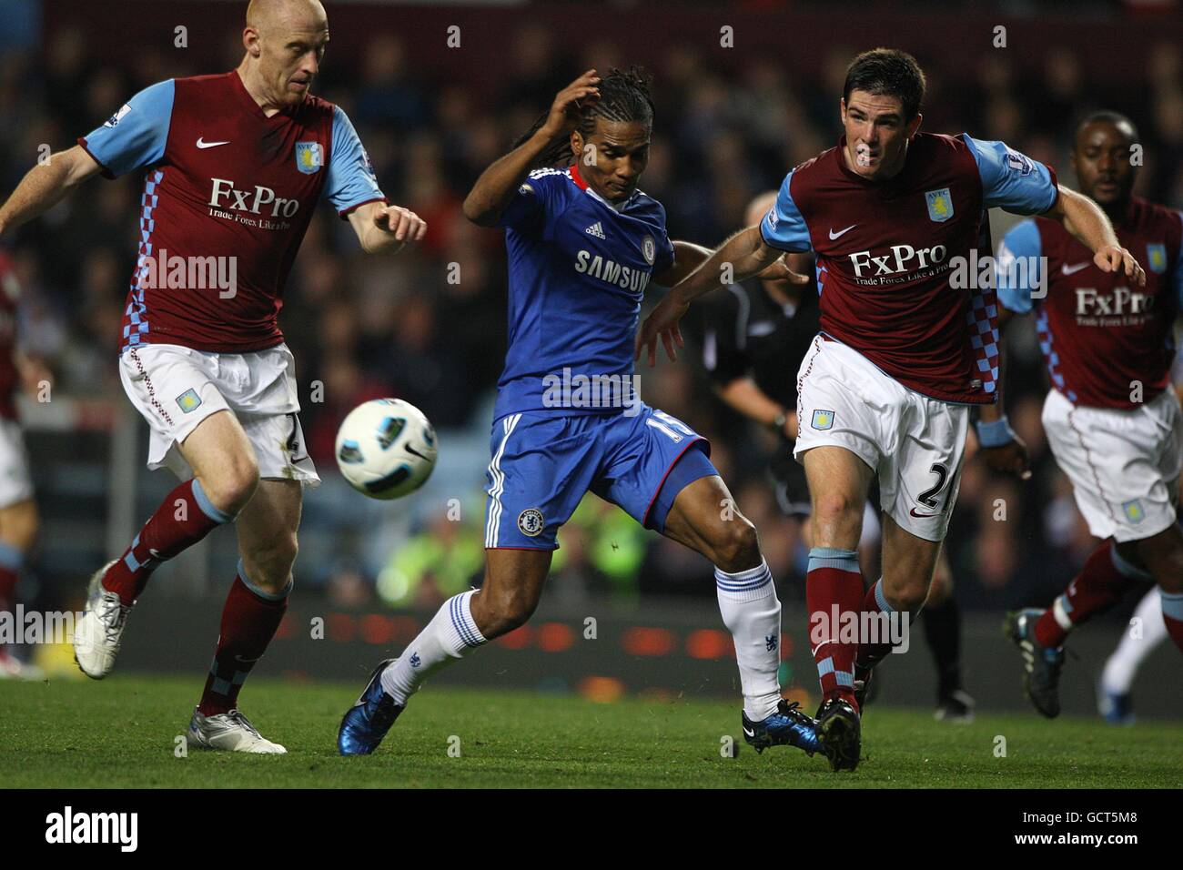 Aston Villa's James Collins (left) and Ciaran Clark (right) battle with ...