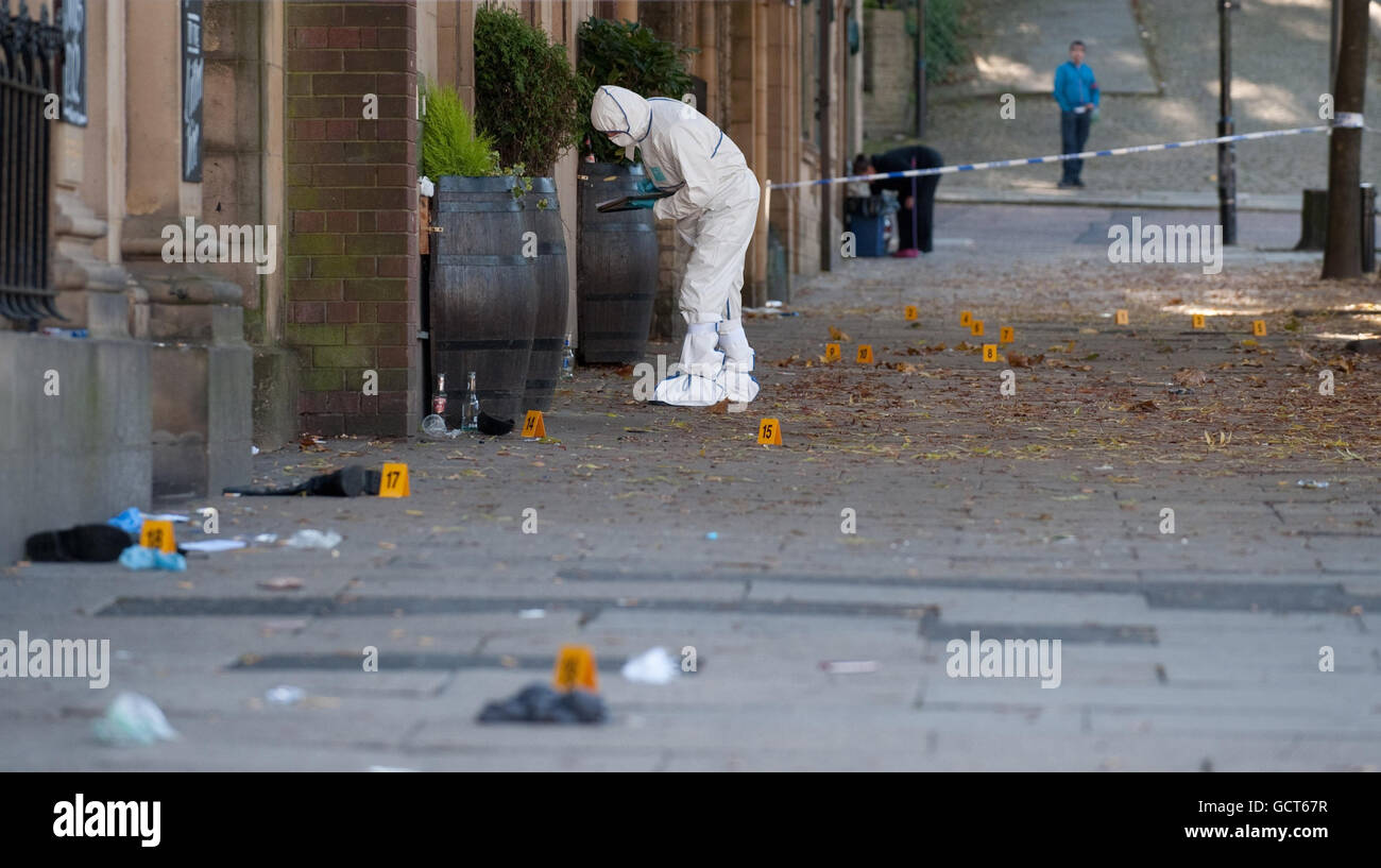 Police forensic officers at the scene on Packer Street in Rochdale ...