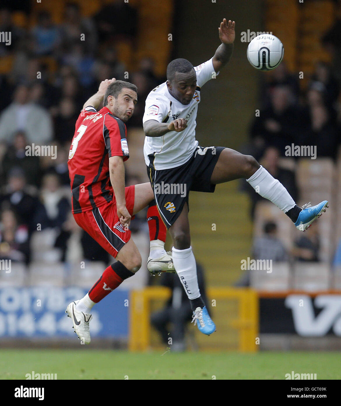 Gillingham's John Nutter competes with Port Vale's Jemal Johnson (right ...