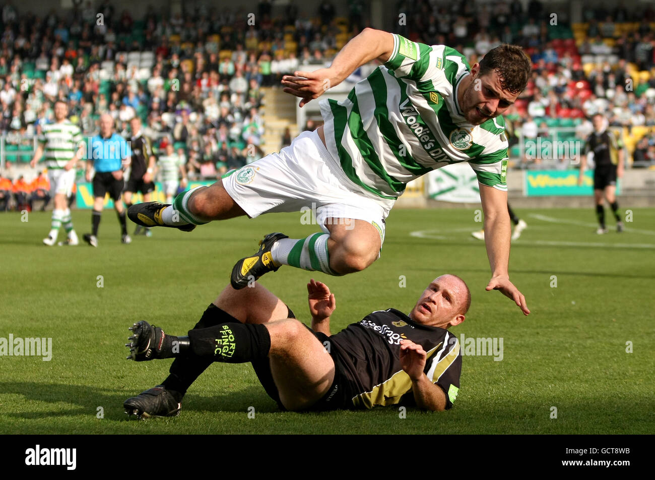 Shamrock rovers james chambers left receives a strong tackle hi-res ...