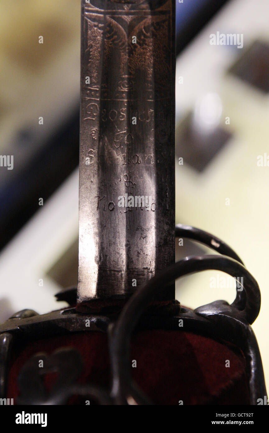 A Jacobite basket-hilt sword with the inscription Prosperity to ...