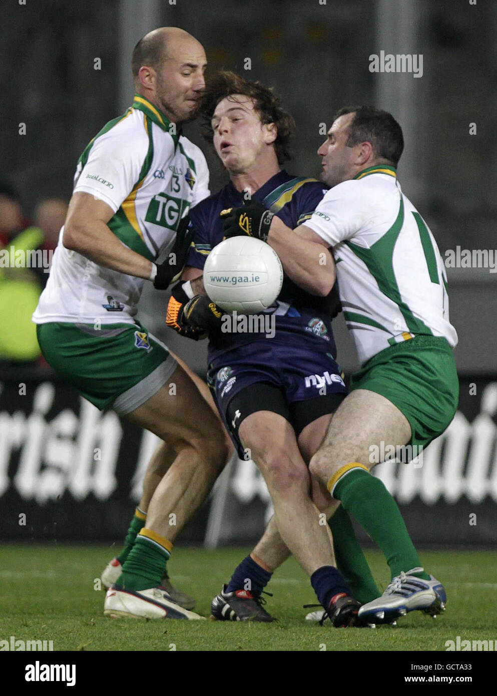 Ireland's Steven McDonnell and Tadhg Kennelly tackle Australia's Liam ...