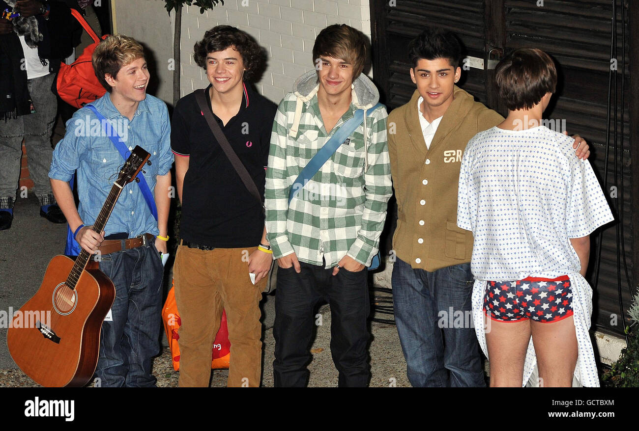 The boy band One direction, who are contestants in the TV show the X ...