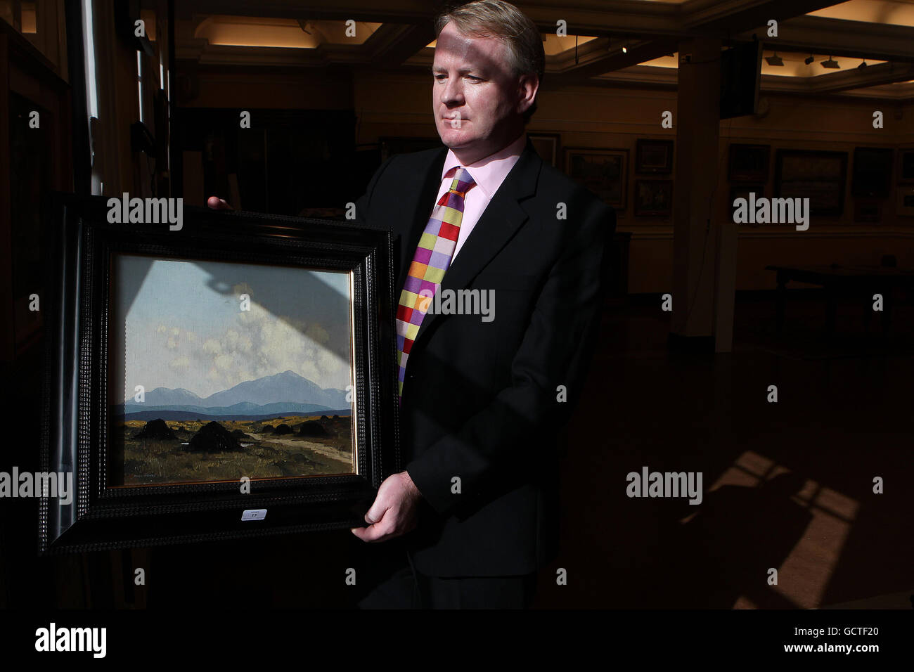 David Brittan from Adams Auctioneers with painting The Bog Road, by ...