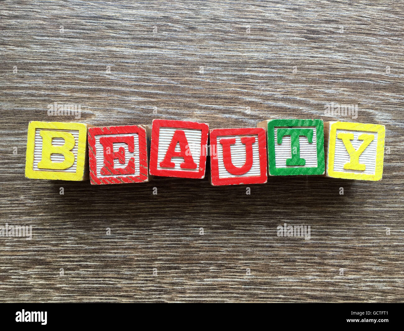 BEAUTY word written with wood block letter toys Stock Photo - Alamy