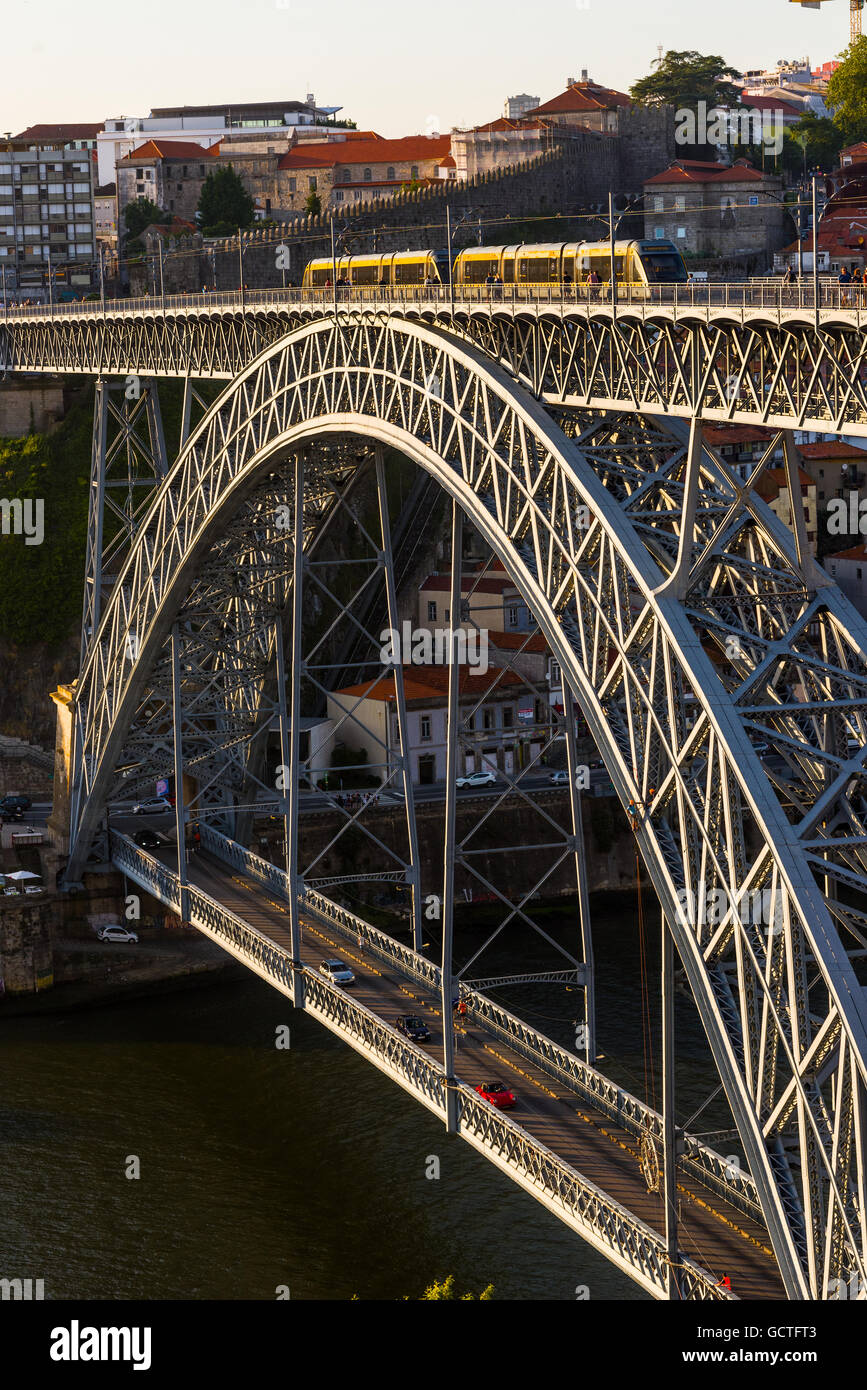 Metro train crossing Dom Luis I (or Luiz I) bridge over Douro river in ...