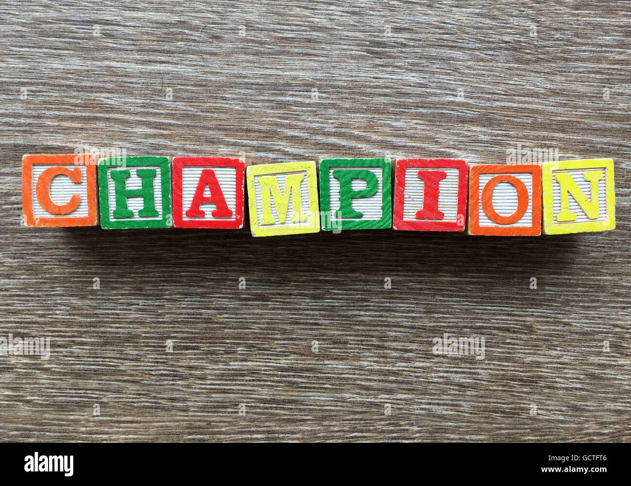 CHAMPION word written with wood block letter toys Stock Photo - Alamy