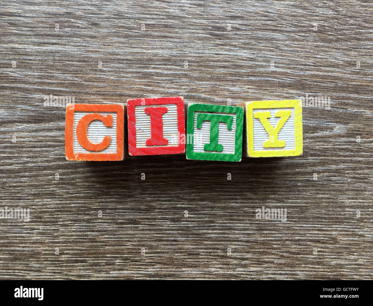 CITY written with wood block letter toys Stock Photo - Alamy