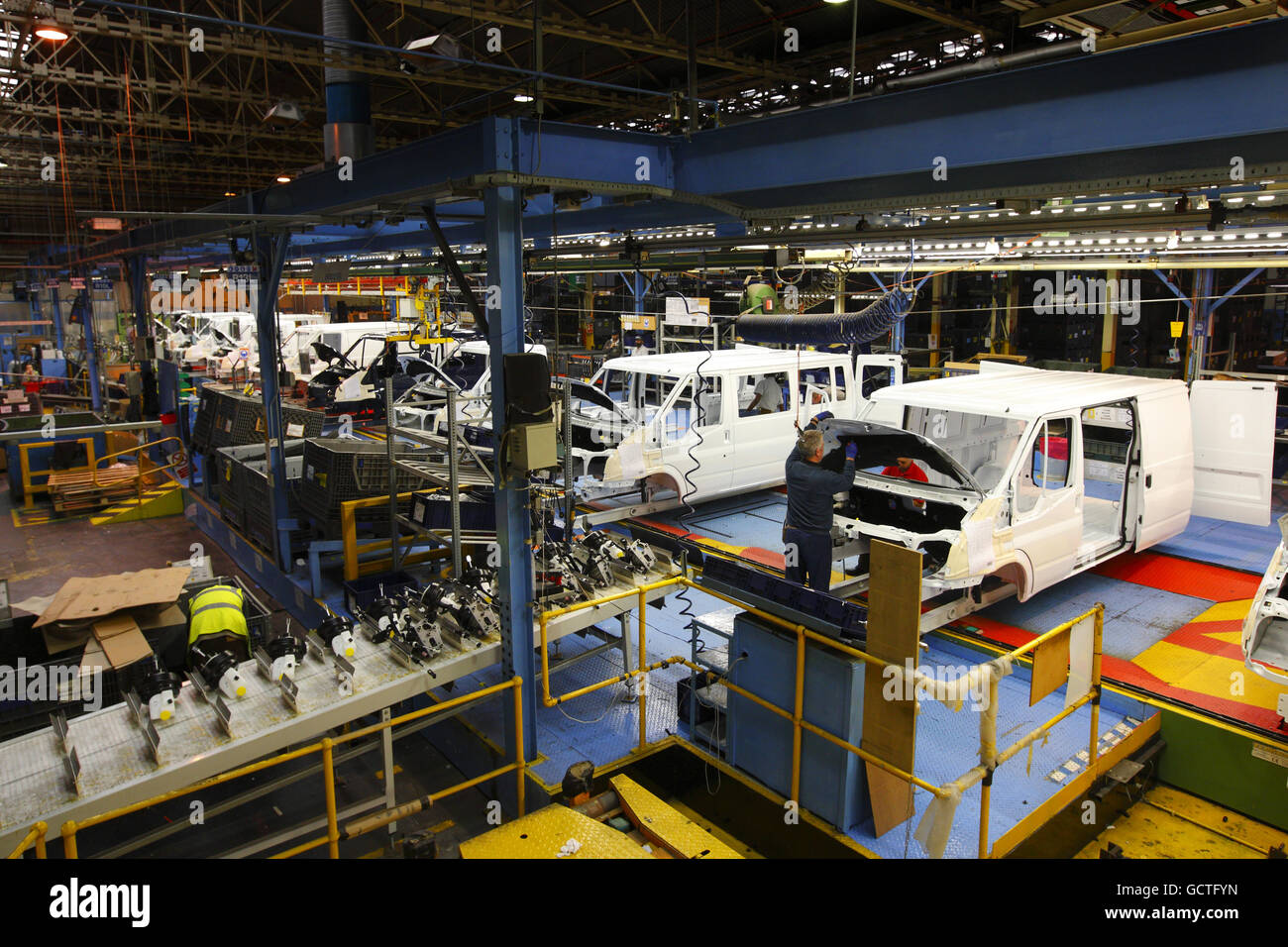 Ford workers assemble Transit vans at their factory in Southampton ...