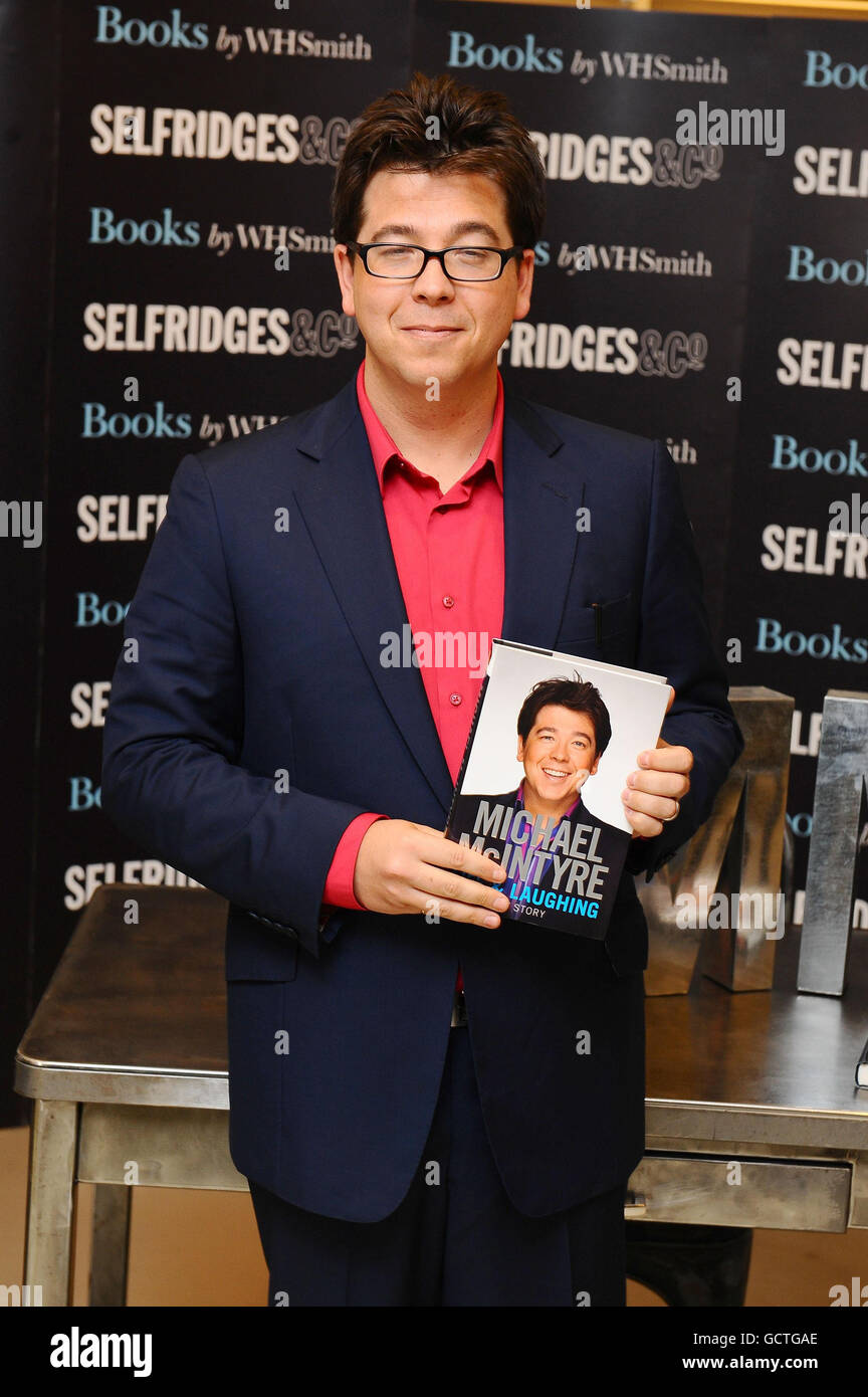 Michael mcintyre signs copies of his new book hi-res stock photography ...