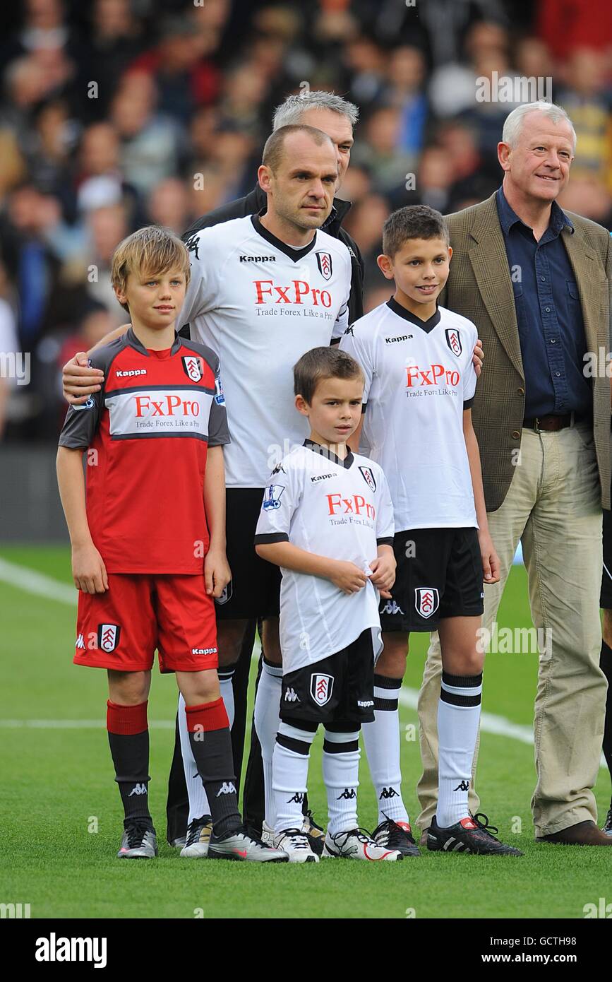 Fulham's Danny Murphy with match-day mascots prior to kick-off Stock ...