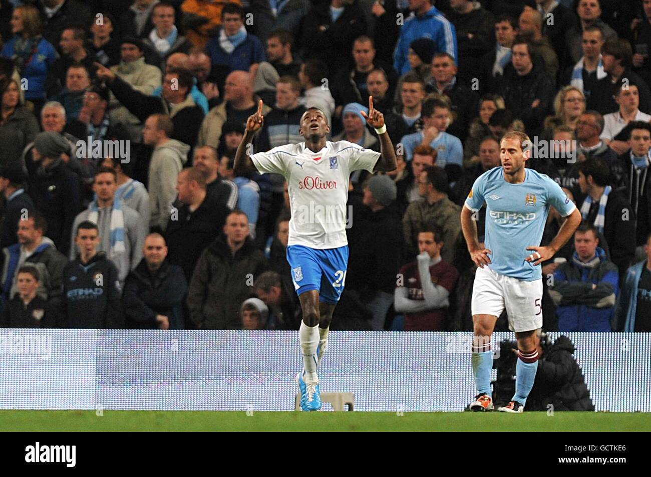 Lech Poznan's Joel Tshibamba (left) celebrates scoring their first goal ...
