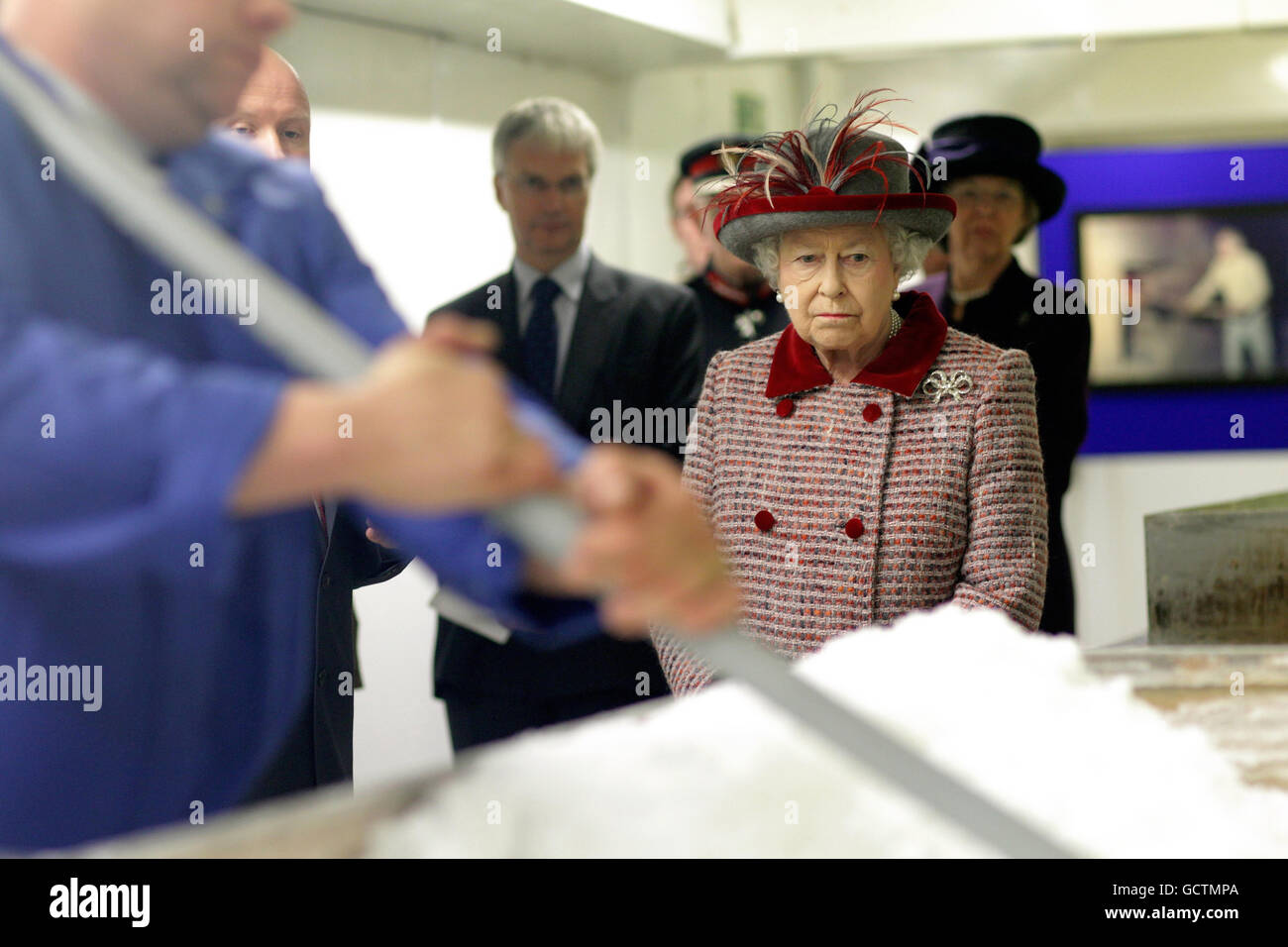 Britain's Queen Elizabeth II is shown the process of salt crystal ...