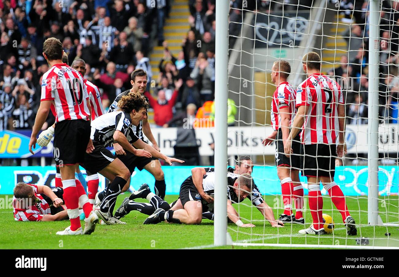 Newcastle United's Kevin Nolan (centre) celebrates scoring his sides ...
