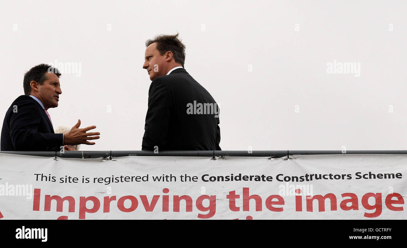 Prime Minister David Cameron talks to Lord Coe (left) as he visits the ...