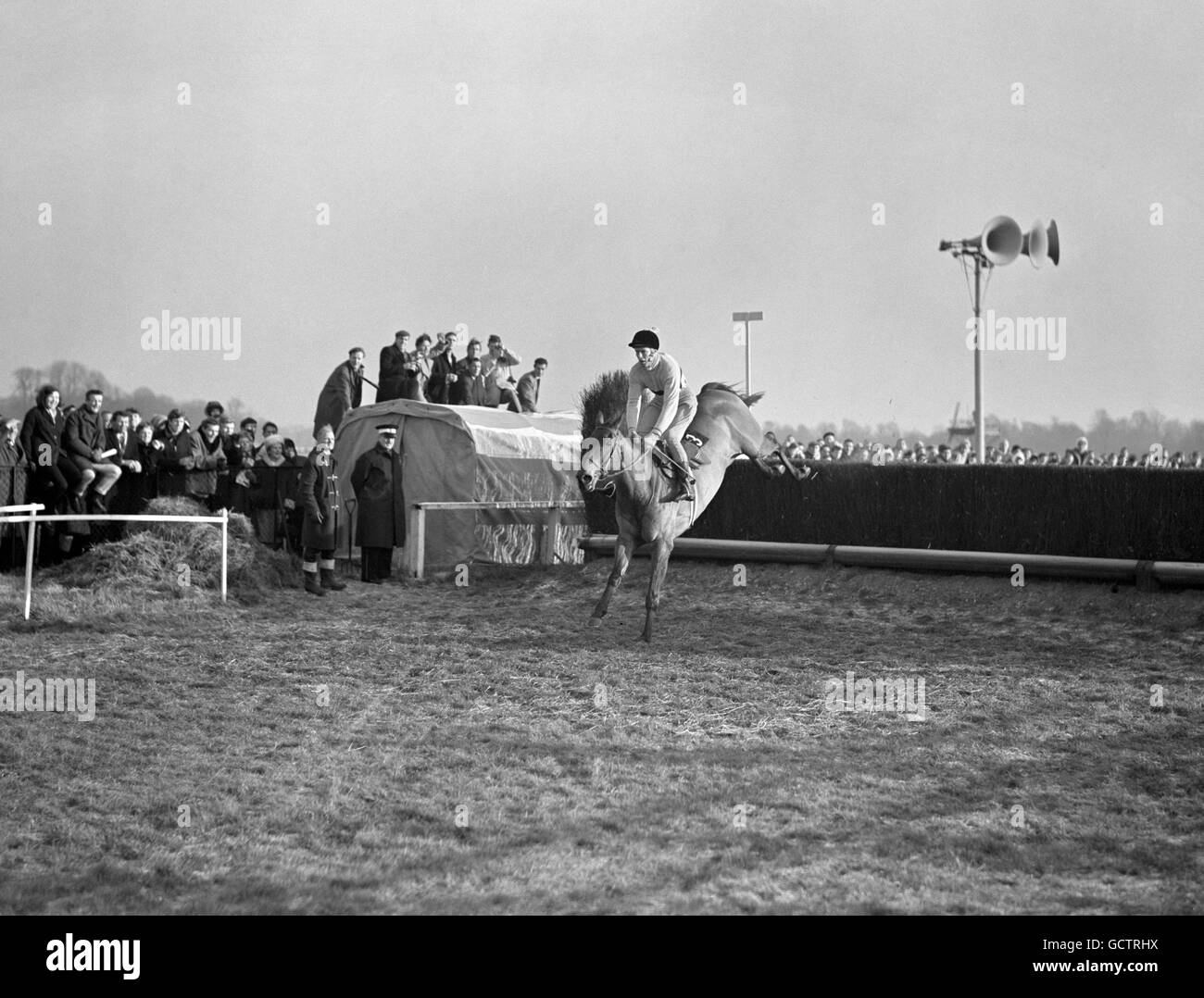 Arkle, Pat Taaffe up, clears the last fence to win the King George VI ...