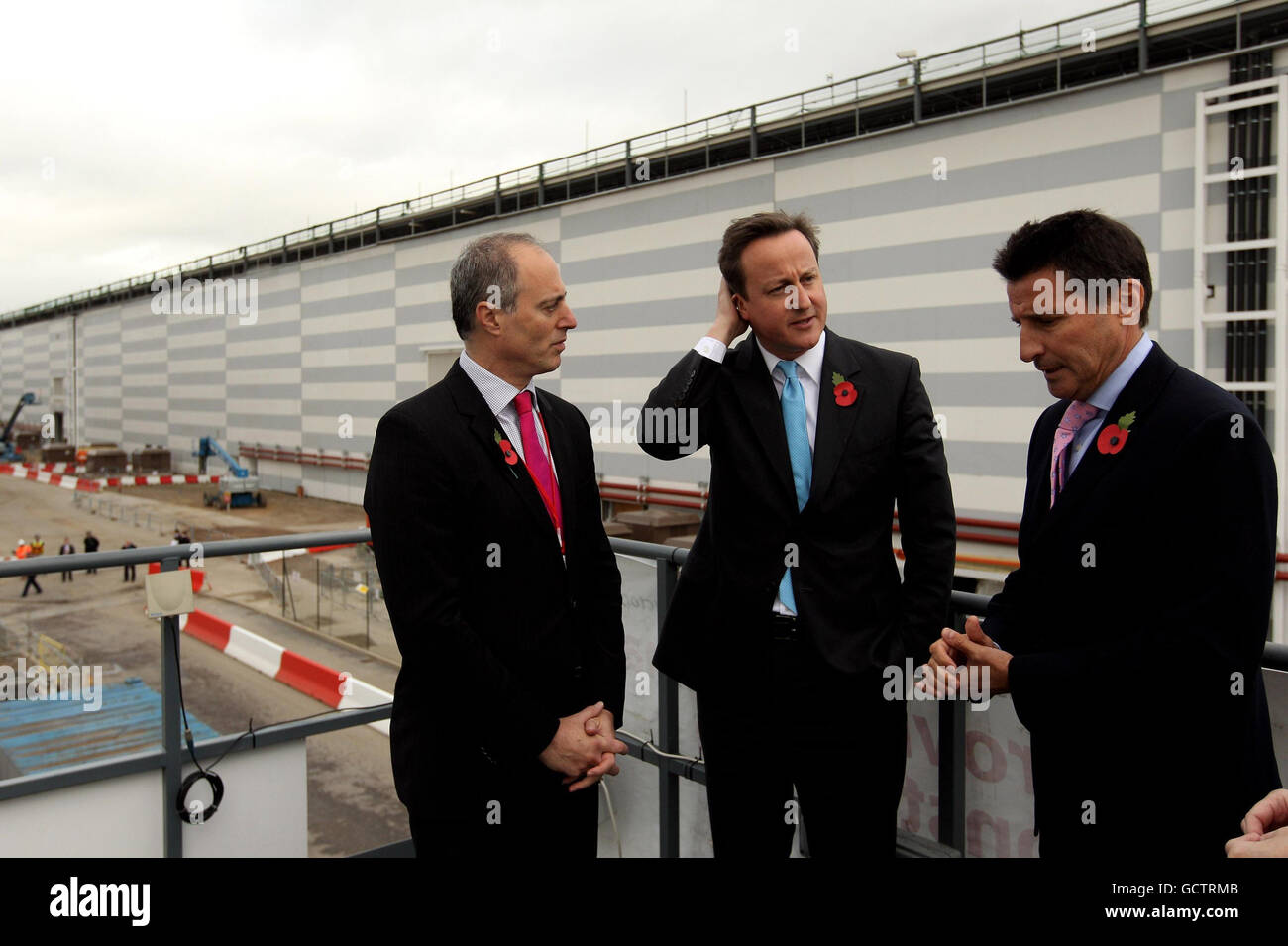 Prime Minister David Cameron talks to Lord Coe (right) and an ...