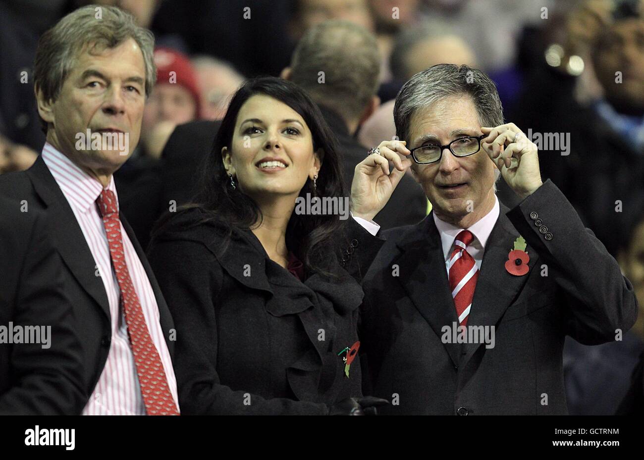 Liverpool owner John W Henry (right) with partner Linda Pizzuti, and ...