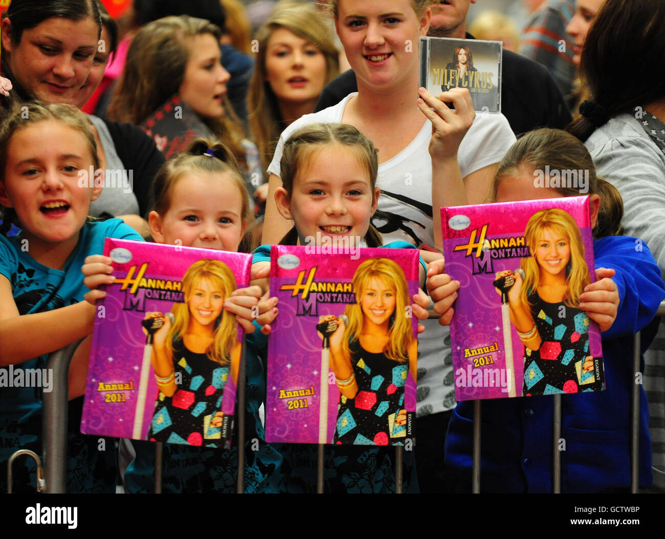Fans at Asda's Spondon store in Derby, where Miley Cyrus was promoting ...