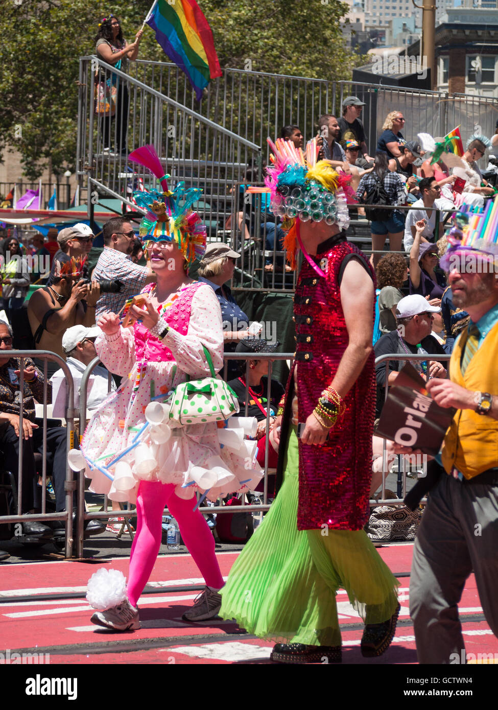 A group of people in colorful costumes parade at San Francisco Pride ...