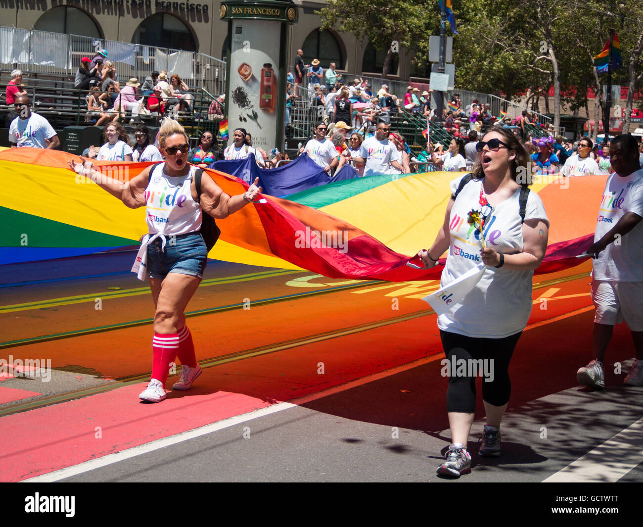 Women singing holding a giant gay flag, San Francisco Pride Parade 2016 ...