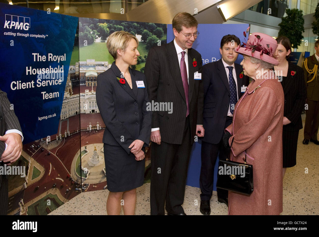 Queen Elizabeth II talks to staff members during a visit to mark the ...