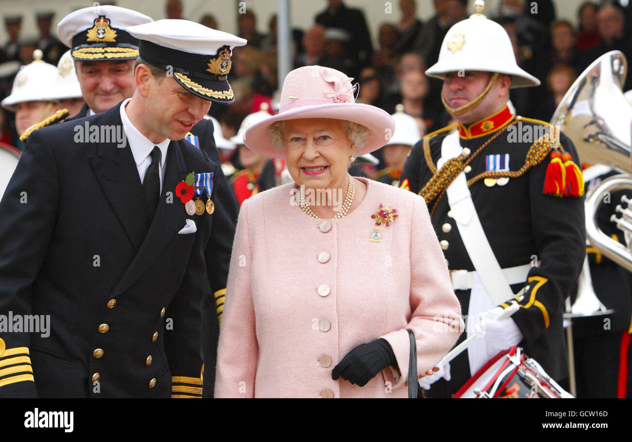 Queen Elizabeth II inspects the band of the Royal Marines during a ...