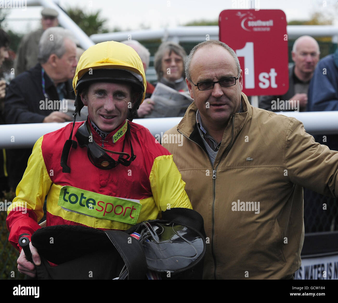 Paul Hanagan and trainer Richard Fahey (right) after victory on Sloop ...