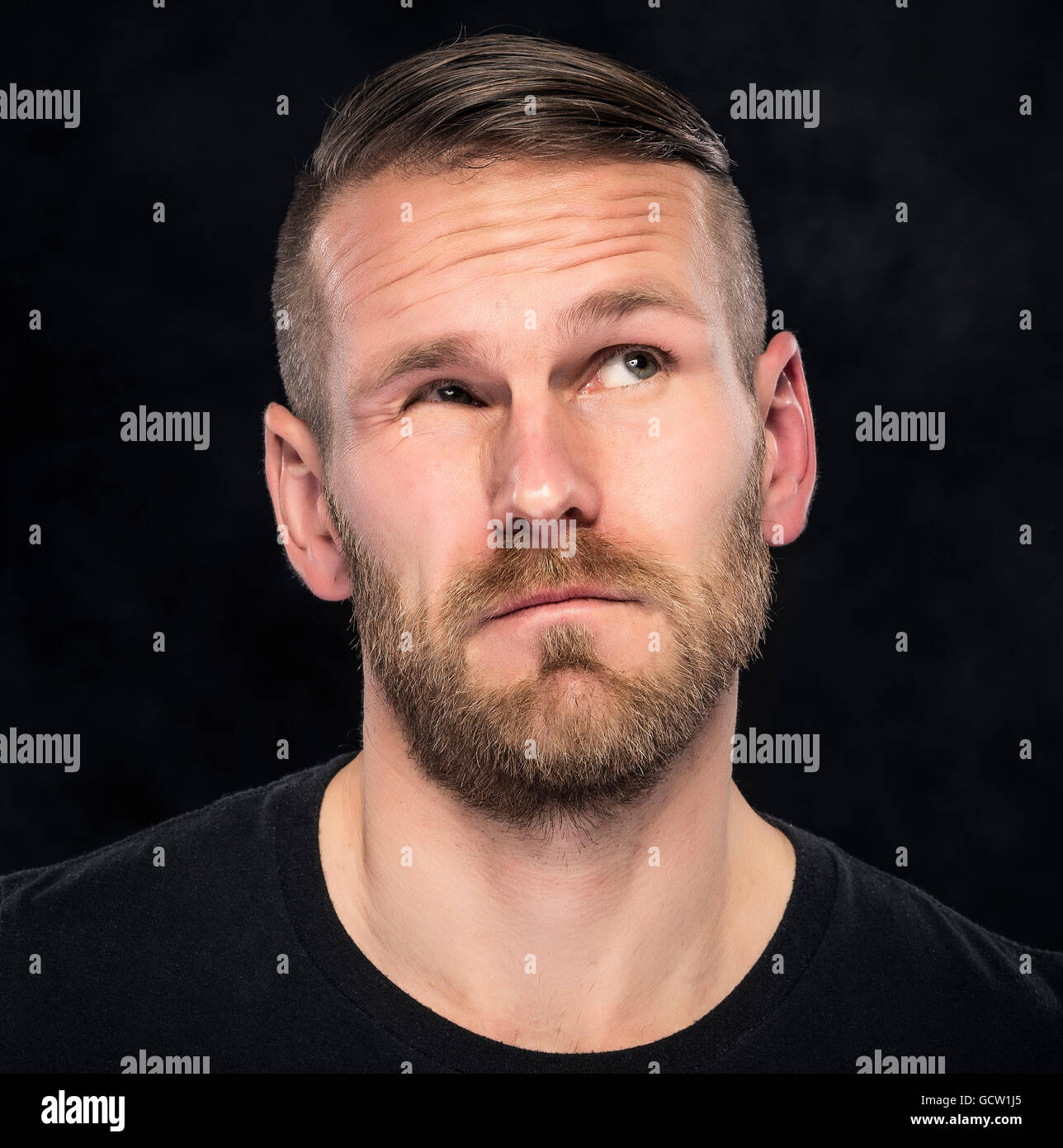 Portraite of funny man on a dark background Stock Photo - Alamy