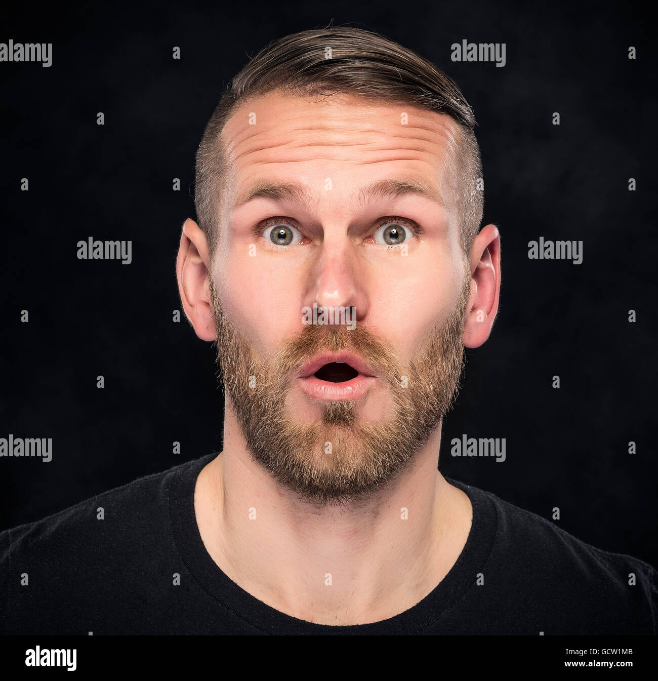 Portraite of funny man on a dark background Stock Photo - Alamy