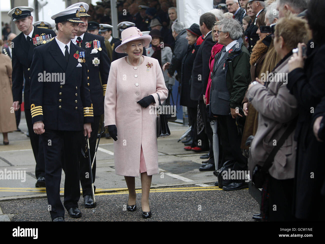 Queen Elizabeth II inspects the guard during a visit to HMS Ark Royal ...