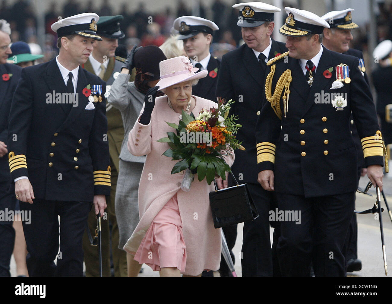 Queen Elizabeth II inspects the guard during a visit to HMS Ark Royal ...