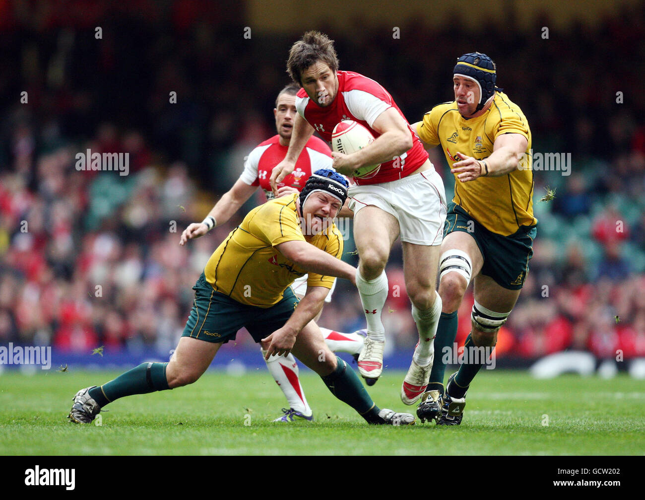 Wales' Andrew Bishop evades Australia's Benn Robinson during the ...