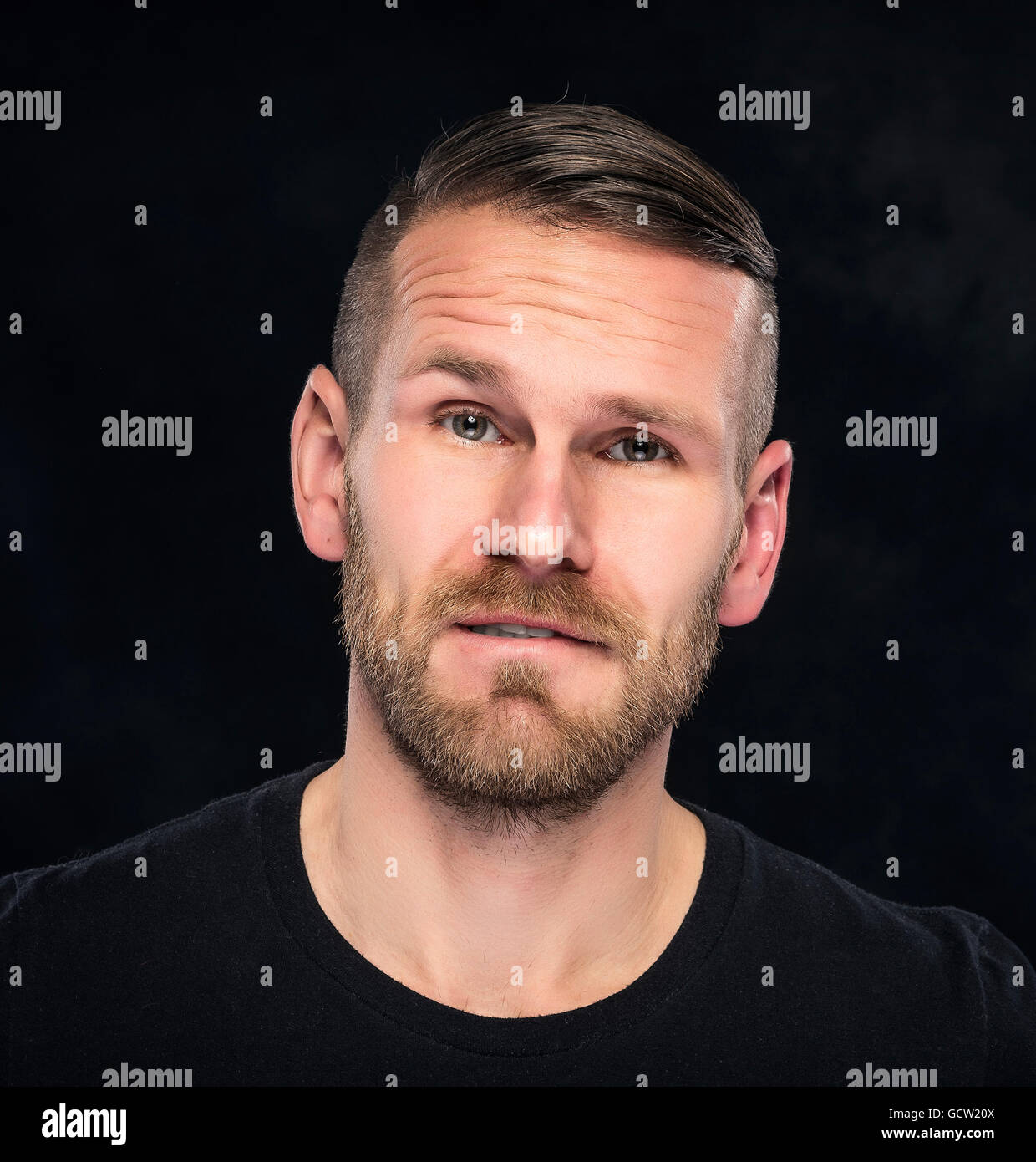 Portraite of funny man on a dark background Stock Photo - Alamy