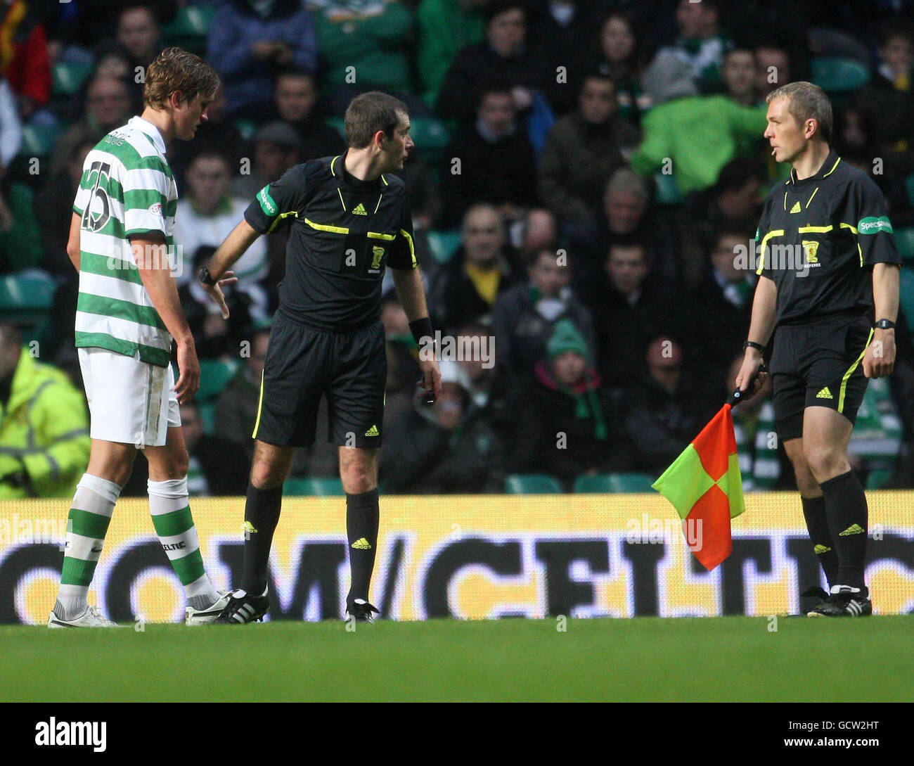 Referee Alan Muir sends off Celtic's Thomas Rogne (left) during the ...