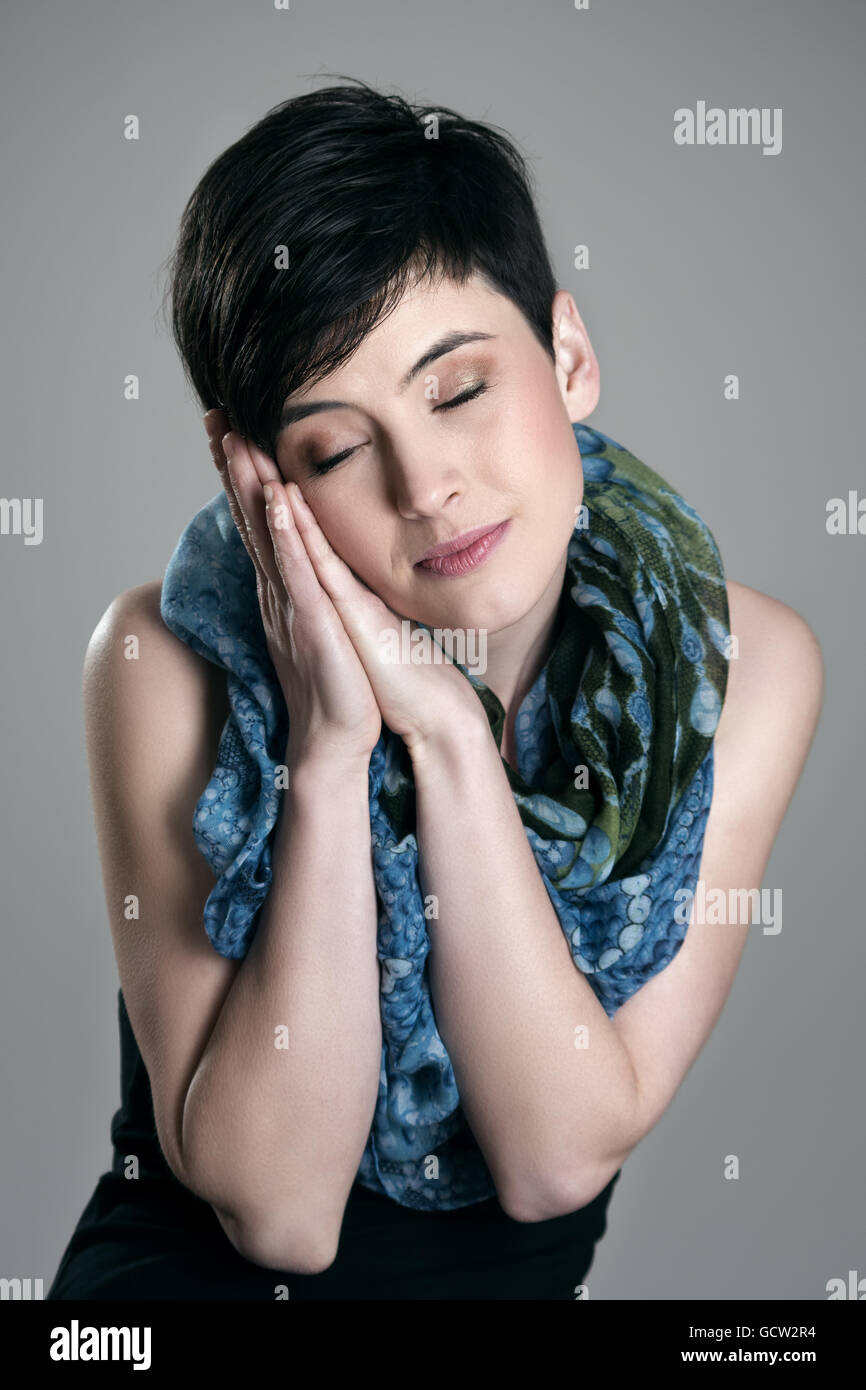 Cute pretty short hair woman pretending to sleep wearing colorful ...