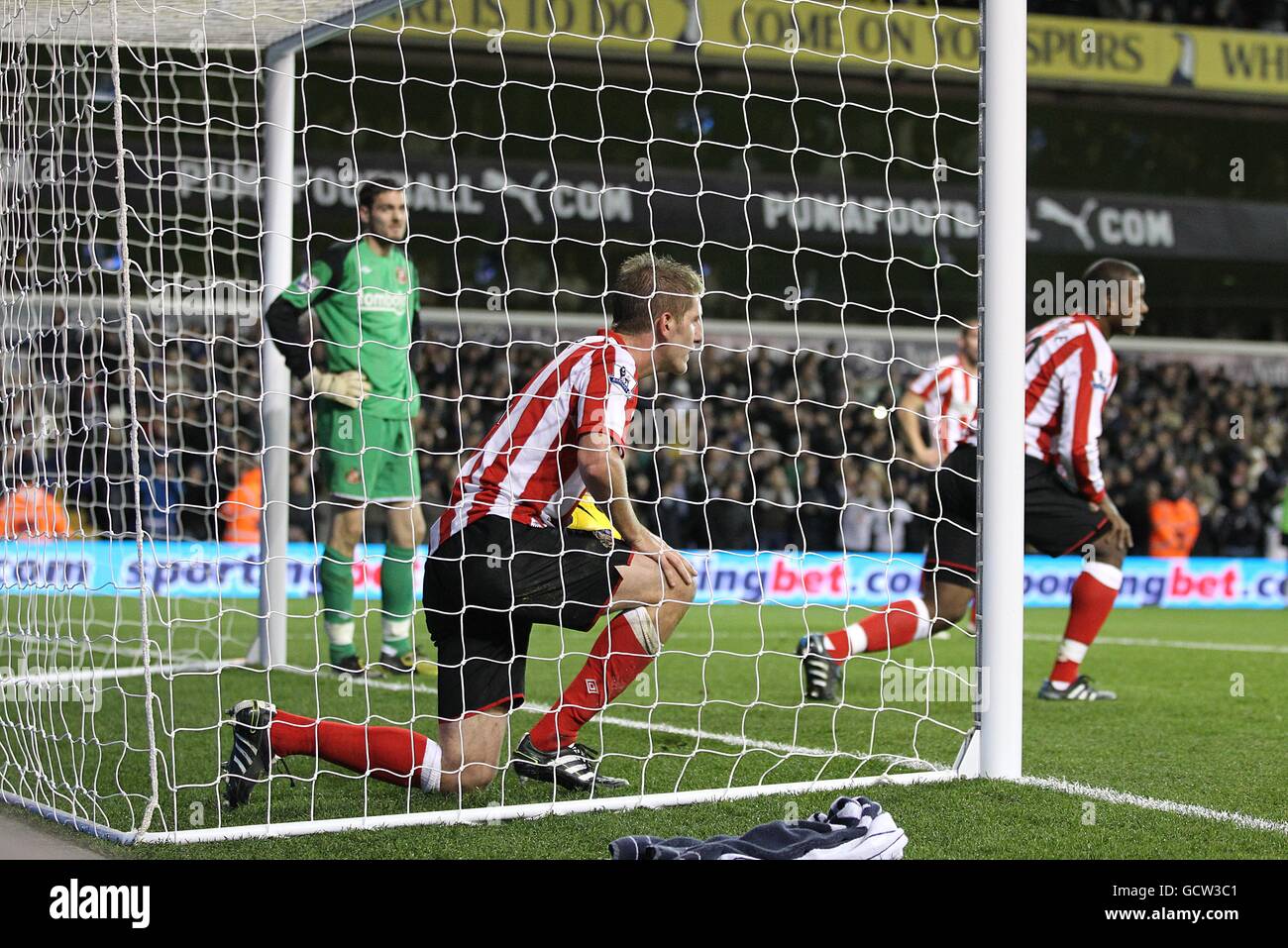 Sunderland's Craig Gordon (left) and Michael Turner (centre) stand ...