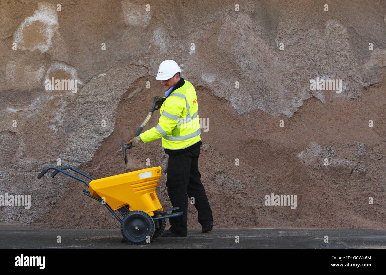 Wheelbarrow pile mound salt grit hi-res stock photography and images ...