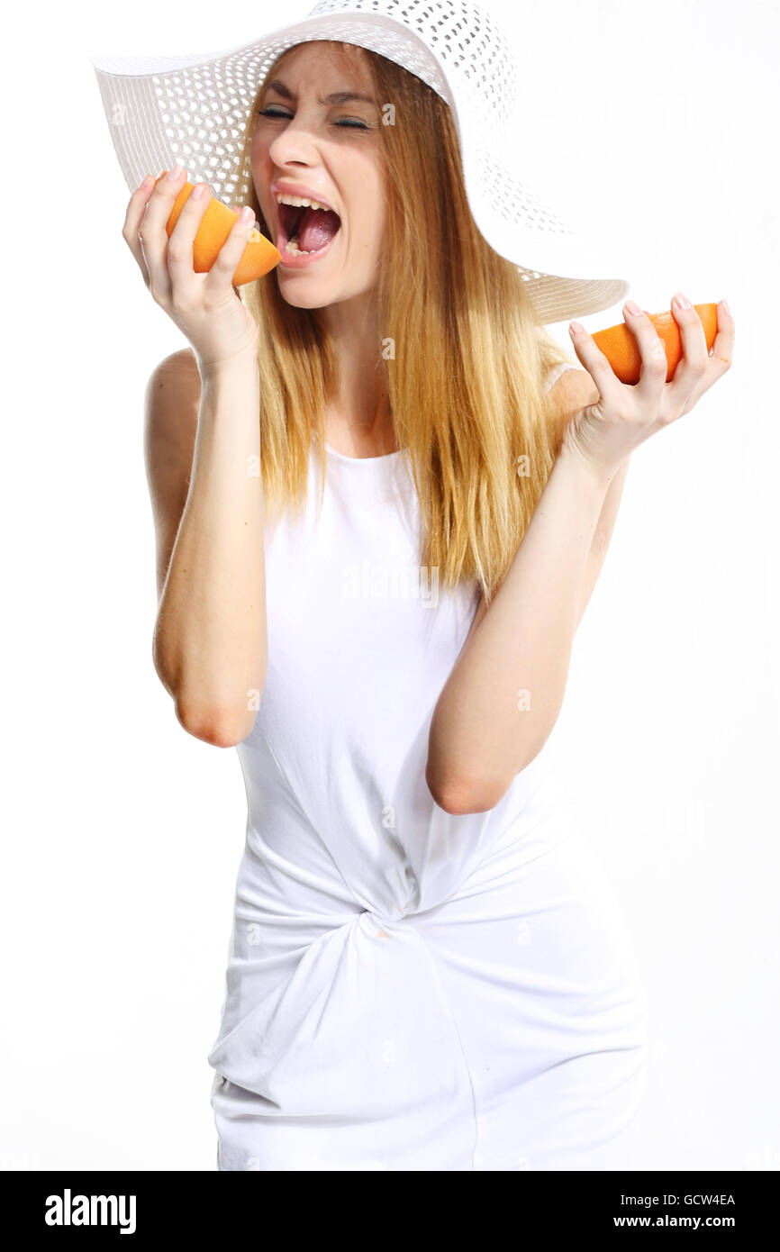 Girl with fresh grapefruit Stock Photo - Alamy