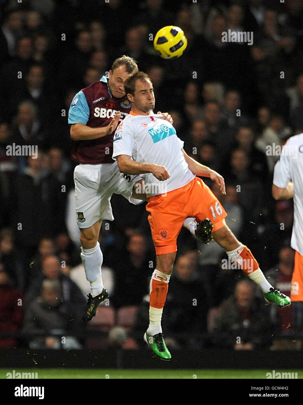 West Ham United's Lars Jacobsen (left) and Blackpool's Luke Varney ...