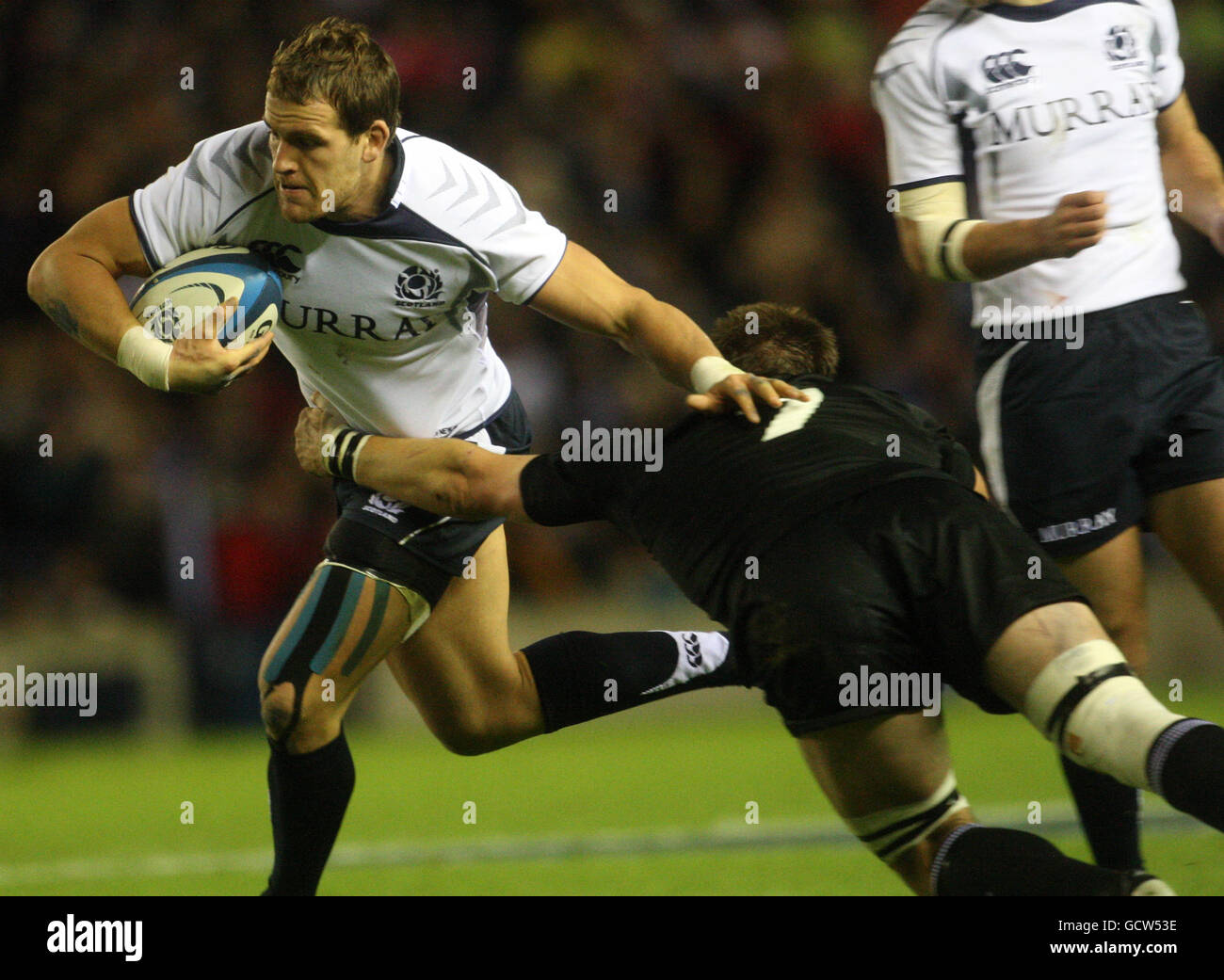 Scotland's Rory Lamont and New Zealand's Richie McCaw during the 2010 ...